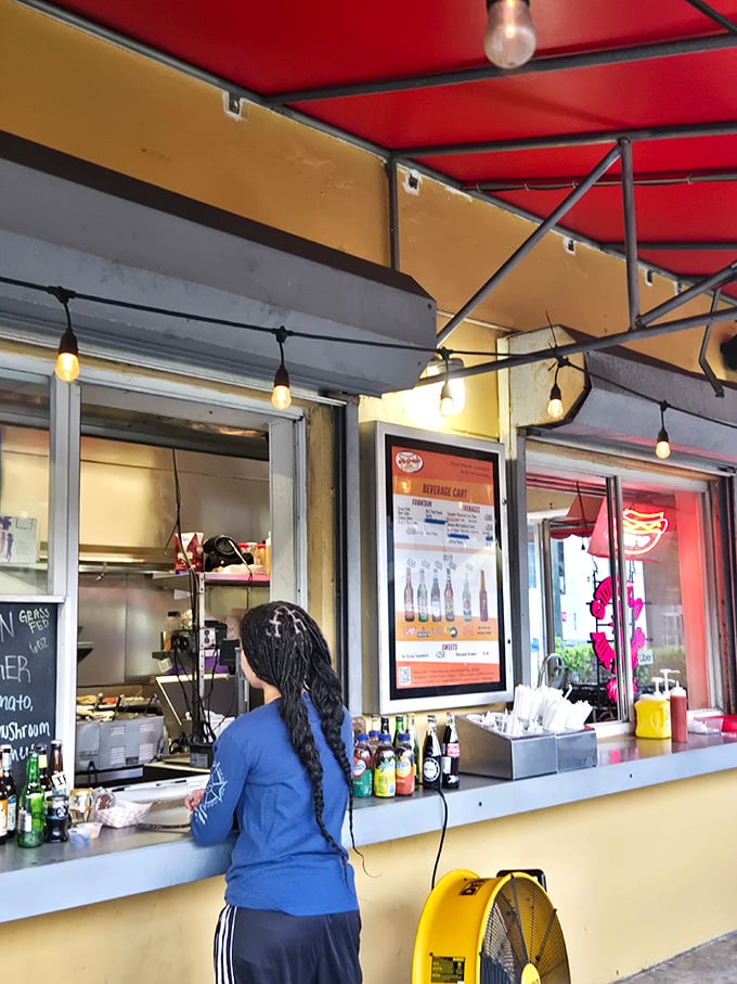 Red counter stools await their next occupants, ready to support the weight of both diners and their culinary expectations.