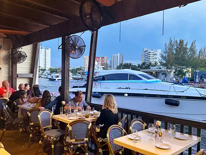 Front-row seats to Miami's aquatic highway—where yacht-watching becomes the perfect between-courses entertainment.