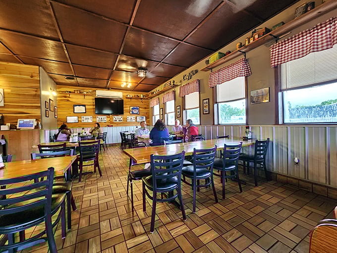 Morning conversations flow as easily as the coffee here, where regulars and newcomers share tables and stories under the warm ceiling glow.