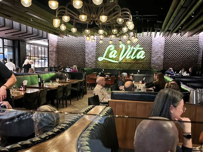 The "La Vita" sign isn't just decor—it's truth in advertising for a dining room where the good life happens one bite at a time.