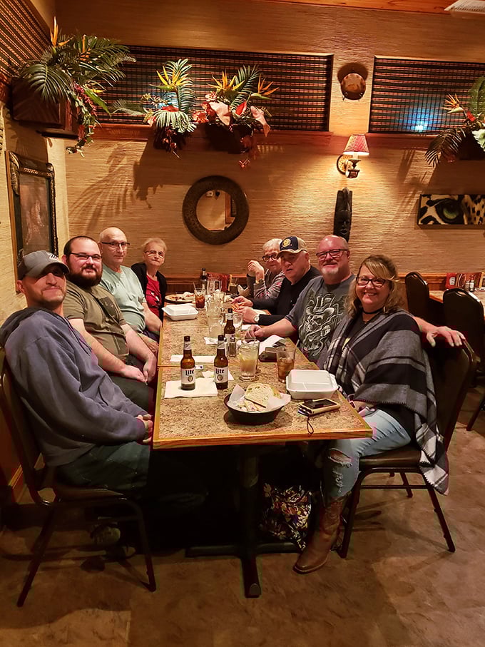 Where memories are made between bites. The warm wood tones and tropical accents create the perfect backdrop for family gatherings and food-induced joy.