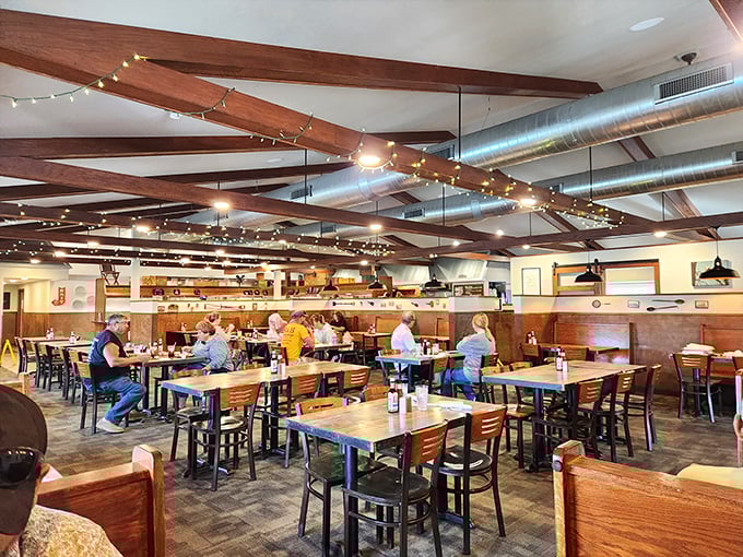 The string lights overhead aren't just for ambiance—they're celebrating the communion of friends, family, and perfectly cooked protein below.