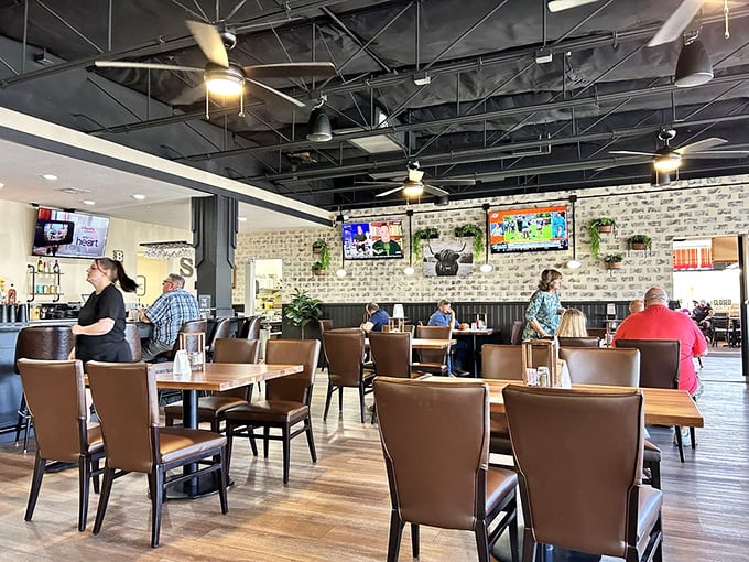 The dining area balances nostalgia with contemporary comfort, where families gather and solo diners feel equally at home among exposed brick and warm wood.