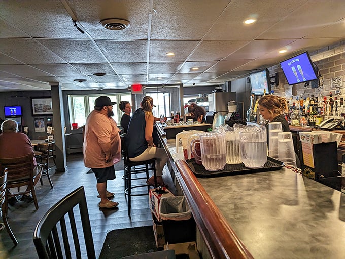 The bar area—where strangers become friends and locals share tales of the big fish that definitely didn't get away.