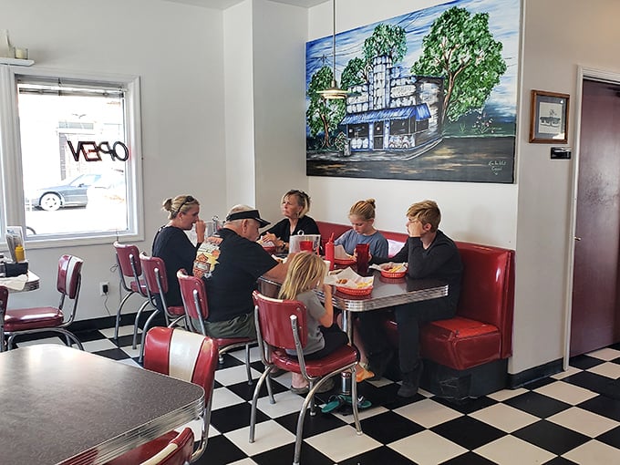 Family gatherings in red booths—where memories are made between bites of comfort food and sips of cold drinks.