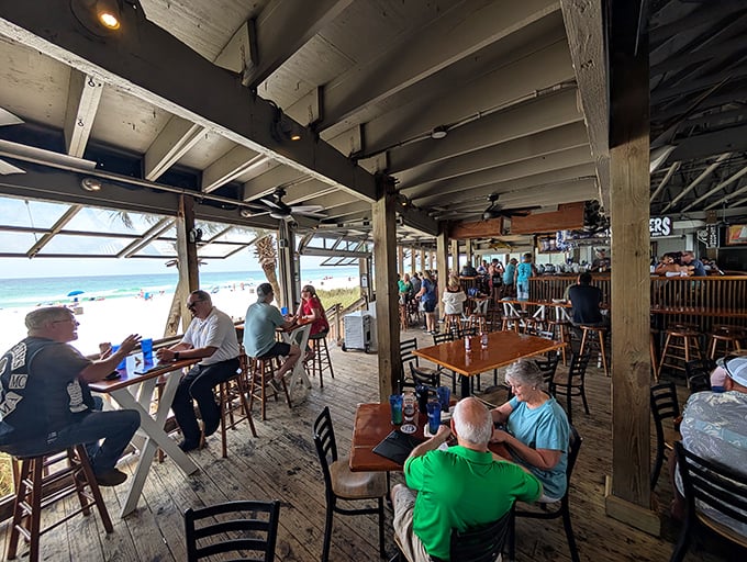 Where the outside comes in and the inside spills out. The line between restaurant and beach blurs deliciously at Schooners' open-air dining area.