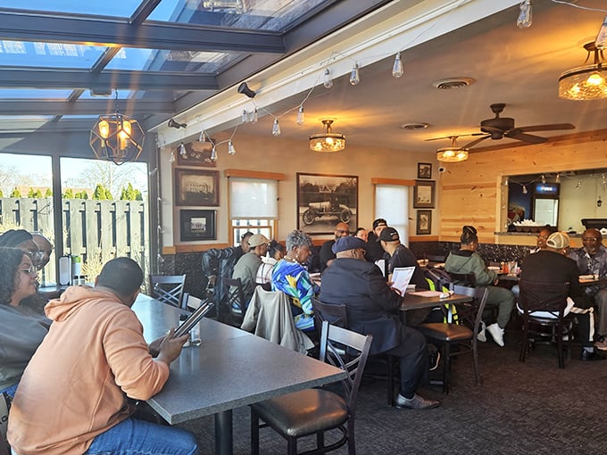 The sunroom dining area—where "eating outdoors" and "climate control" found their happy compromise. Best of both worlds.