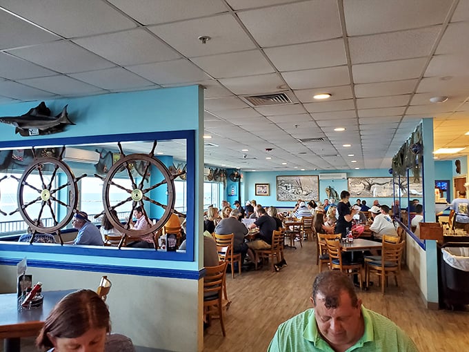 Ship wheels frame diners like maritime portraits—"Family Enjoying Seafood, 2023," a masterpiece of Biloxi dining culture.