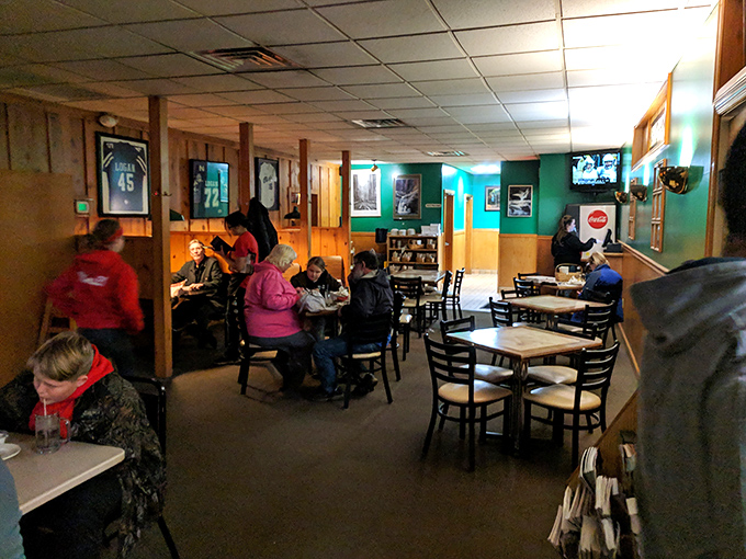 The dining room fills with families who've made Pizza Crossing their Friday tradition since before smartphones existed.
