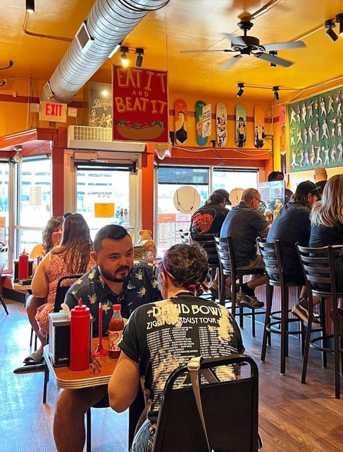The universal language of hot dog appreciation brings strangers together. Notice how nobody's looking at their phones? That's frankfurter magic.