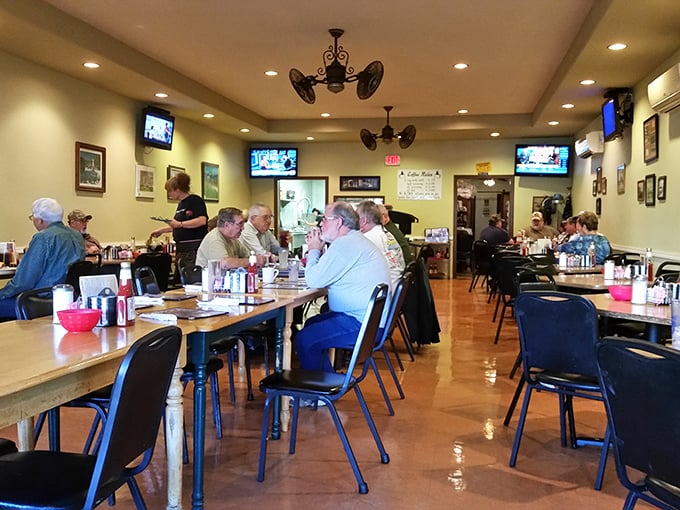 A bustling dining room where conversations flow as freely as the coffee, and everyone seems to know everyone else's business—in the best way possible.
