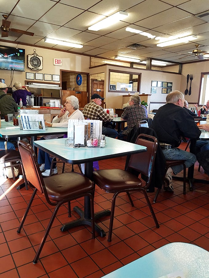 The morning regulars' club in session. These folks have probably solved all the world's problems over countless cups of coffee.