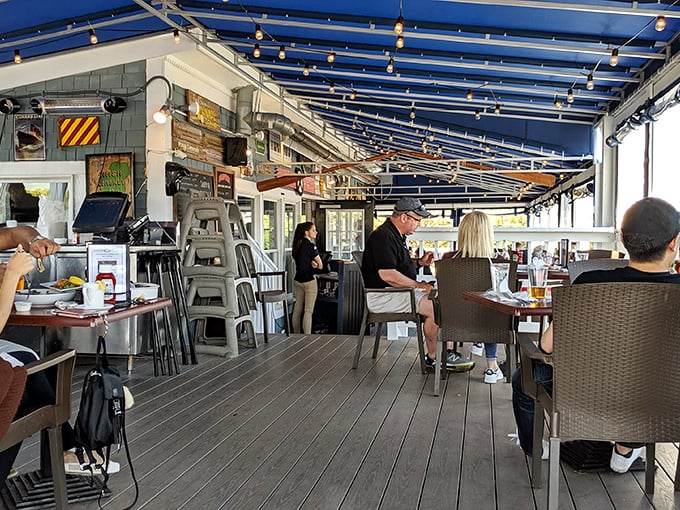 The outdoor deck—where conversations flow as freely as the wine and everyone's suddenly an expert on identifying passing boats.