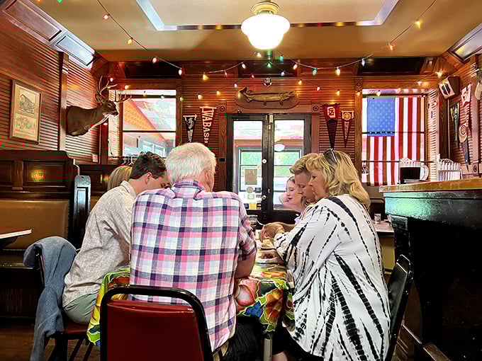 Conversations flow as freely as the drinks at these tables, where strangers often become friends over shared appreciation of exceptional food.