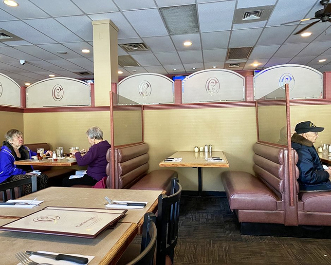 Booths designed for lingering conversations and second helpings. Notice how nobody's rushing—time moves differently when pasta is involved.