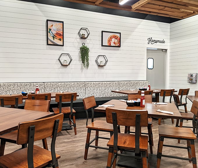 The "Homemade" sign above the kitchen door isn't just decoration—it's a solemn promise delivered in a dining room that feels like your stylish friend's farmhouse renovation.