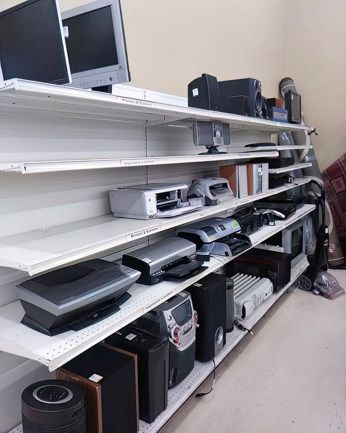 Technology time capsules line these shelves—yesterday's cutting-edge gadgets waiting for either nostalgic collectors or practical repurposers.