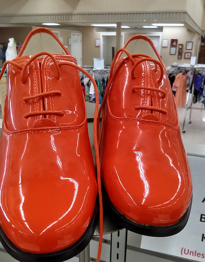 These glossy orange shoes aren't just footwear—they're a statement waiting to happen. Someone's future conversation starter sits patiently on the shelf.