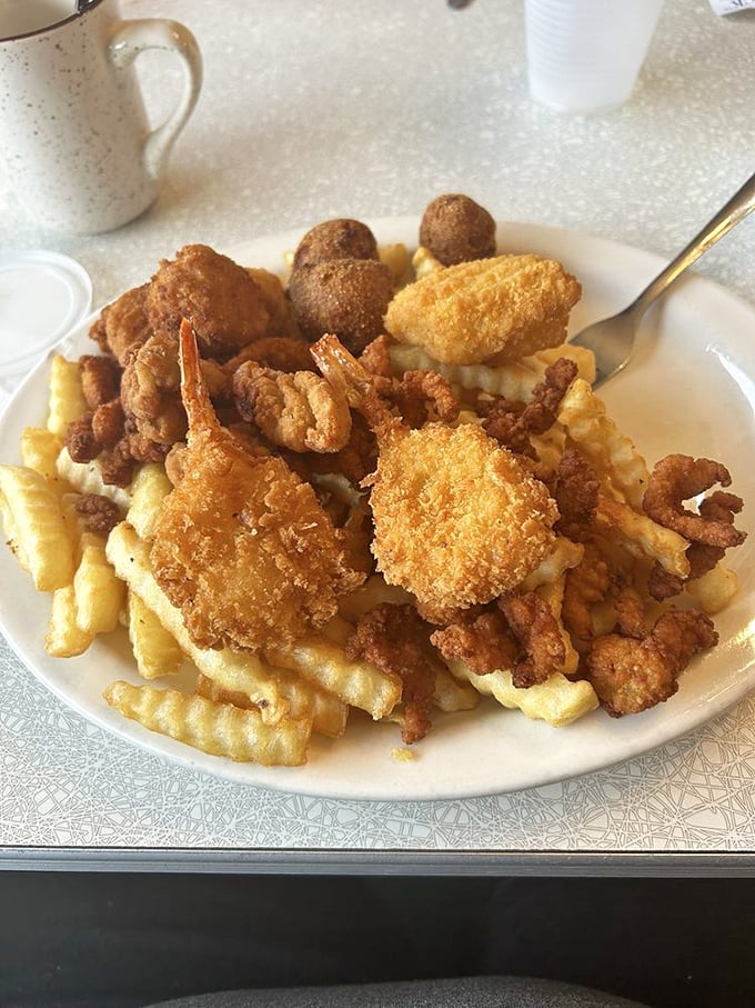A seafood platter that brings the ocean to your table—crispy fried shrimp and hushpuppies that would make Neptune himself request seconds.