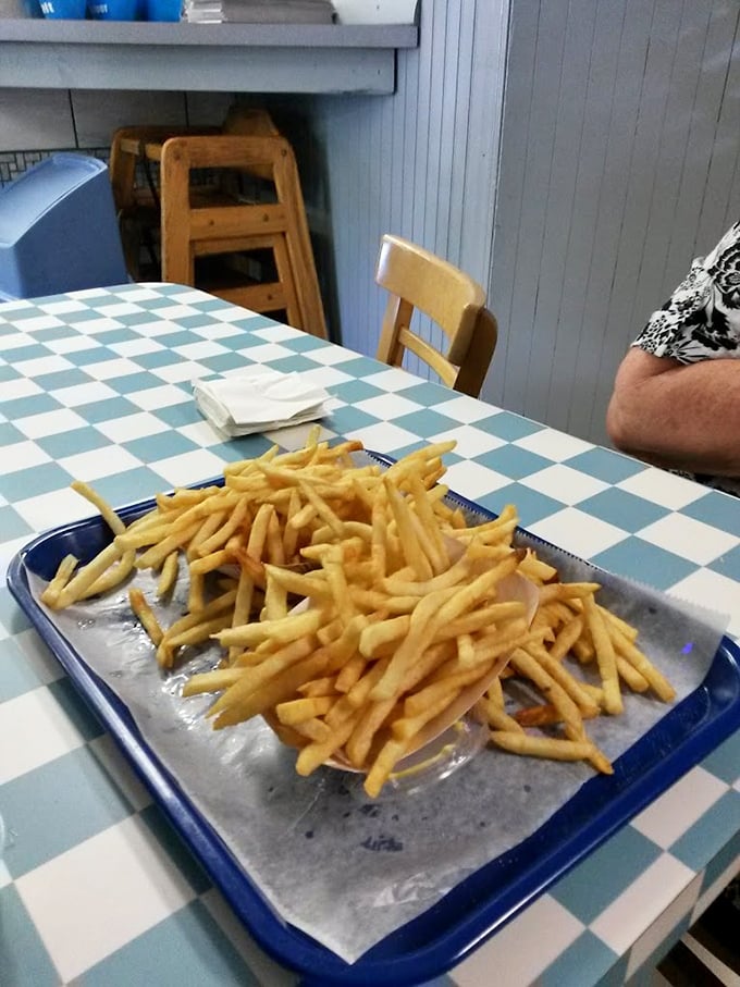 Fries piled high like a mountain of potato perfection. Crispy outside, fluffy inside—the supporting actor that often steals the show.