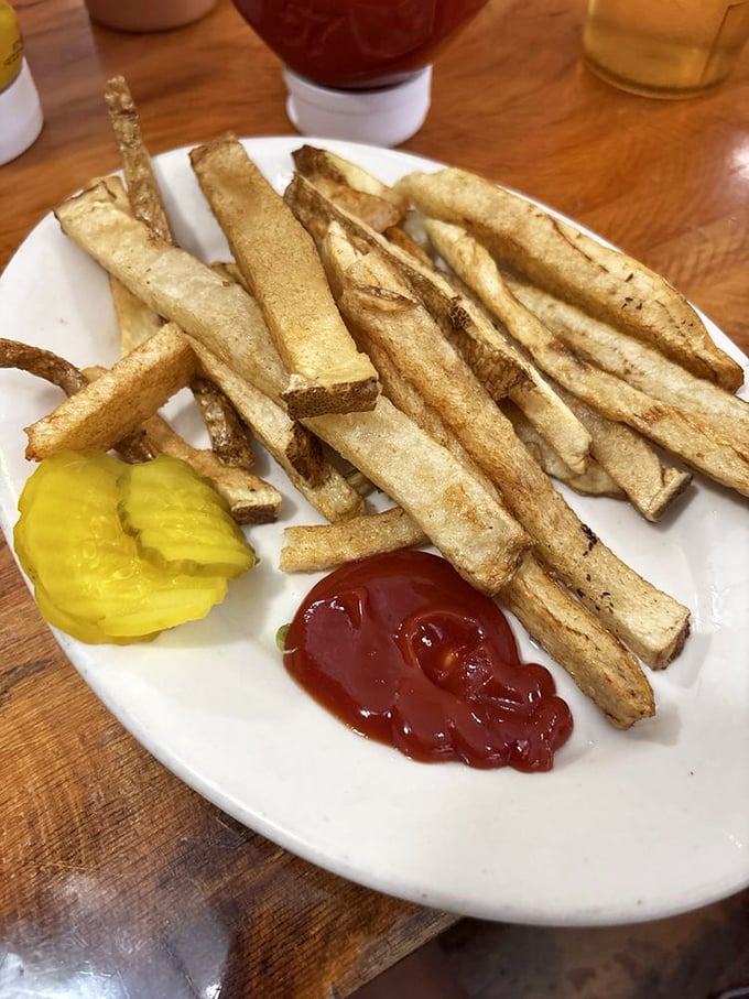 These aren't just fries – they're potato perfection sticks with the ideal crisp-to-fluffy ratio that makes ketchup optional but highly recommended.