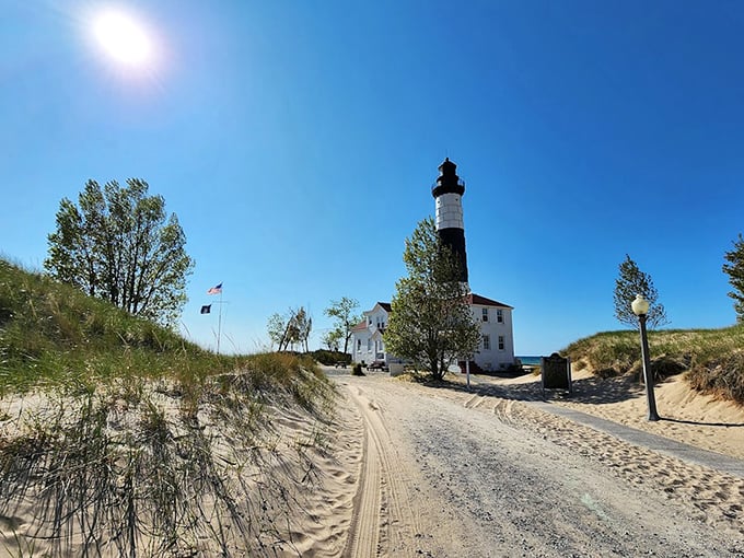 The sandy approach to Big Sable feels like Michigan's version of a desert pilgrimage, with an oasis of maritime history waiting at the end.