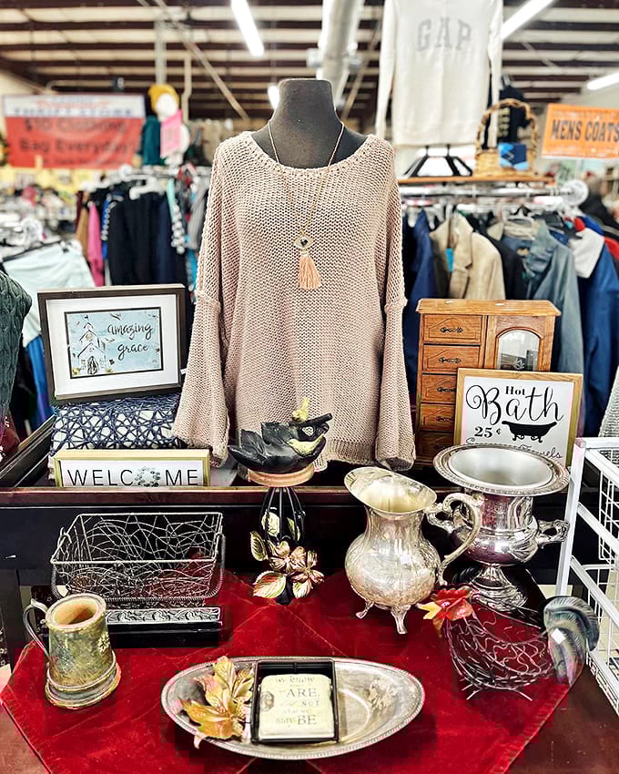 Curated vignettes showcase the store's knack for presentation. That cozy sweater paired with silver serving pieces creates instant "I need that" syndrome.
