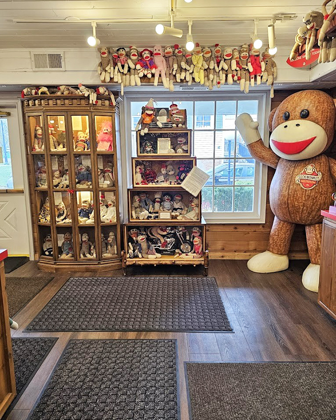 Display cases packed with personality showcase generations of sock monkeys dressed for every occasion imaginable. The giant greeter never misses a photo op.