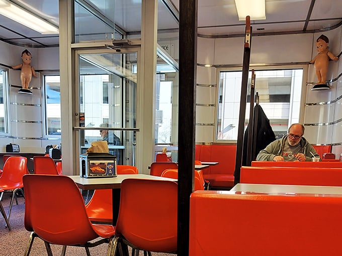 More Kewpee dolls watch over diners from their perches—silent guardians of burger tradition in a world gone mad for food fads.