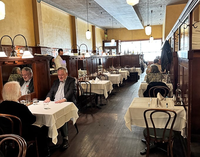 Another angle of the dining room reveals the perfect balance of elegance and comfort – fancy enough for special occasions, comfortable enough for Tuesday lunch.