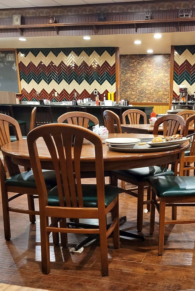 Another angle of diner perfection – where every table tells a story and that chevron wall has witnessed thousands of satisfied sighs.