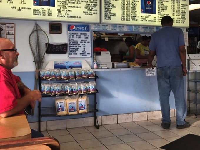 The ordering counter – where dreams of perfect seafood begin. Simple surroundings let you focus on what really matters: deciding between catfish, shrimp, or "why not both?"