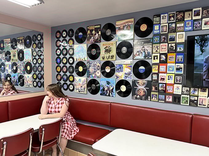 Album covers and vinyl records transform this wall into a jukebox you can see but not hear – the perfect backdrop for conversations about which decade had the best music.