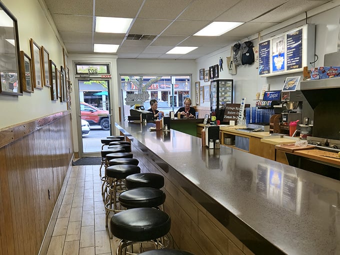 The empty stools await the lunch rush, like front-row seats to a culinary performance that's been running for over a century.