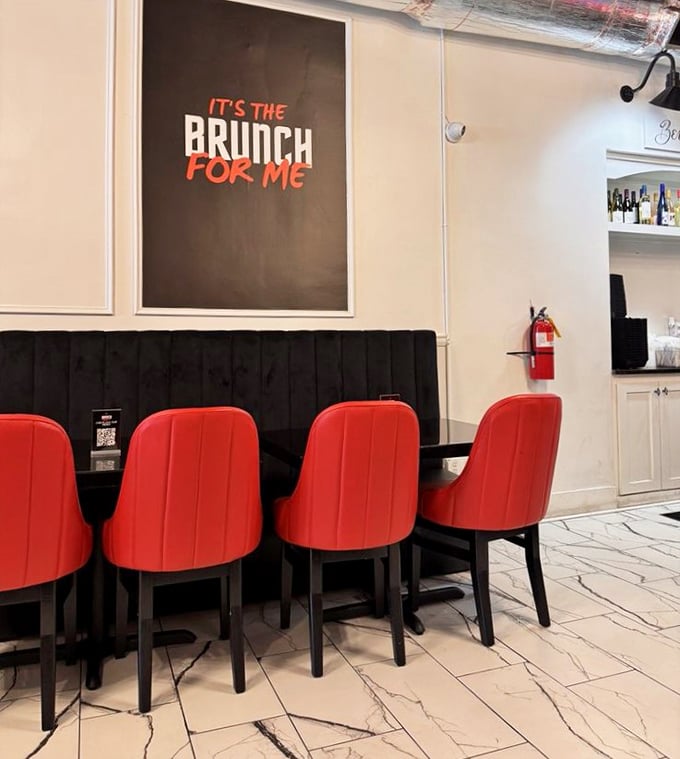 "IT'S THE BRUNCH FOR ME" isn't just wall art—it's the mantra you'll adopt after sinking into those striking red chairs.