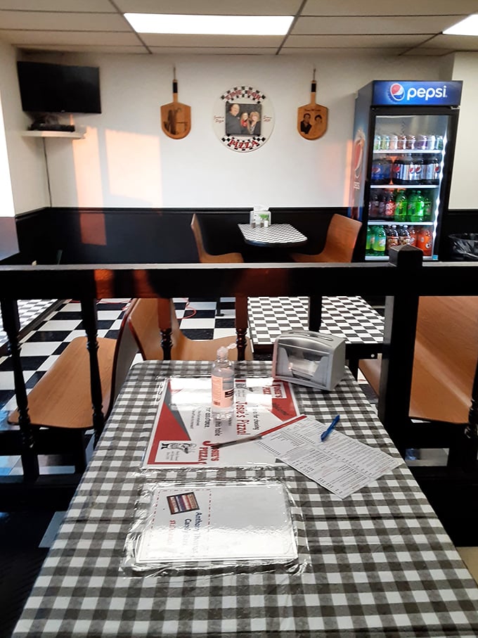 Classic checkered tablecloths and booth seating—the universal signal that you're about to eat something honest and delicious without any foodie pretension.
