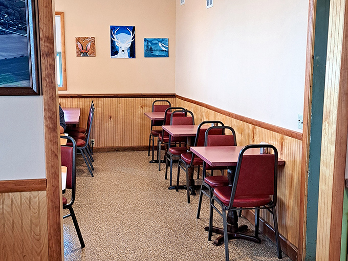 No designer needed for this dining room—just honest wood paneling, simple tables, and chairs that have supported generations of satisfied diners.