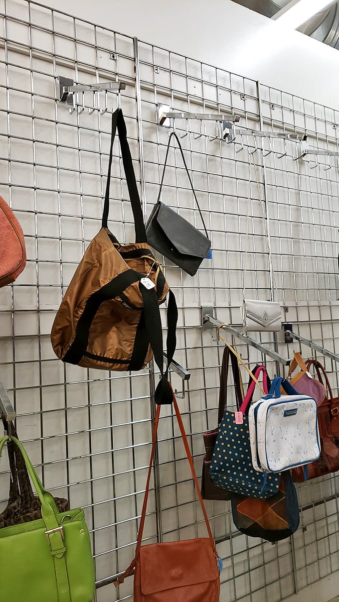 Handbags hang like exotic fruit, ripe for picking. That butter-soft leather tote might have once carried a screenplay to a Broadway producer.