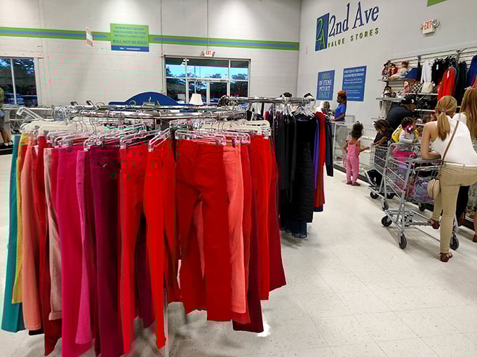 A kaleidoscope of women's pants arranged by color – red-hot deals in every sense of the word.