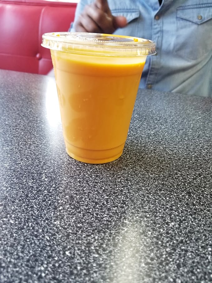 A mango lassi so sunny it could brighten even a Wisconsin winter day—creamy, fruity, and the perfect fire extinguisher for spicy meals.