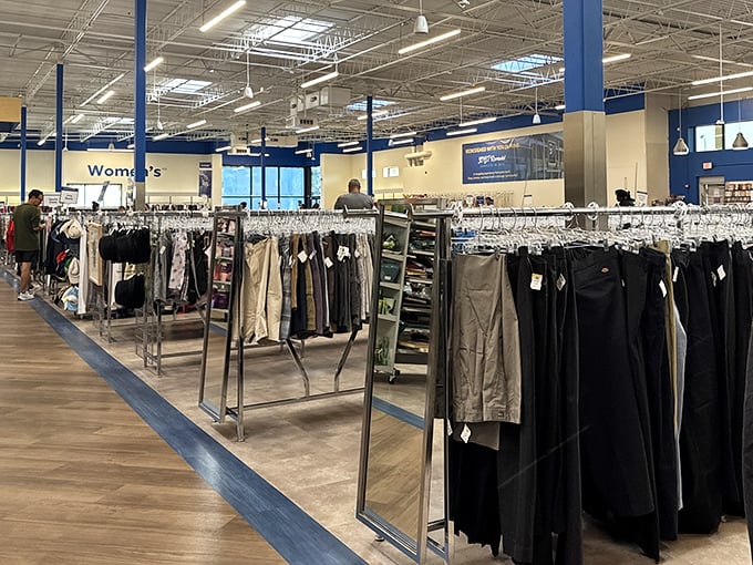 The men's department—where yesterday's business meeting attire awaits tomorrow's job interview, proving that second chances come in all sizes and colors.