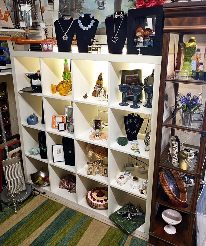 Curated chaos at its finest—each cubby holds a different world, from vintage glassware to miniature houses waiting for new stories.