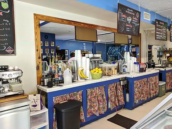 The ordering station, where colorful fabric meets coffee equipment in a dance as charming as the conversation you'll have with whoever's taking your order.