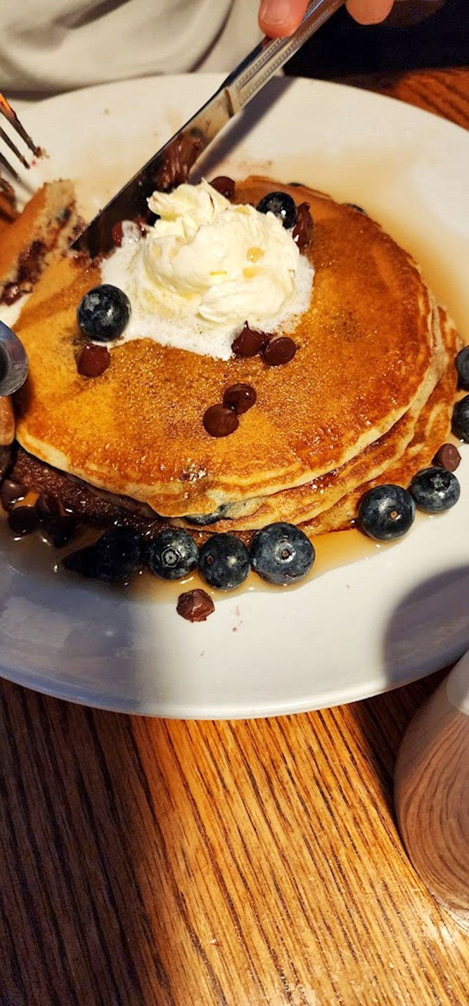 Pancakes that make you understand why breakfast deserves its "most important meal" status. Those blueberries aren't garnish – they're jewels.