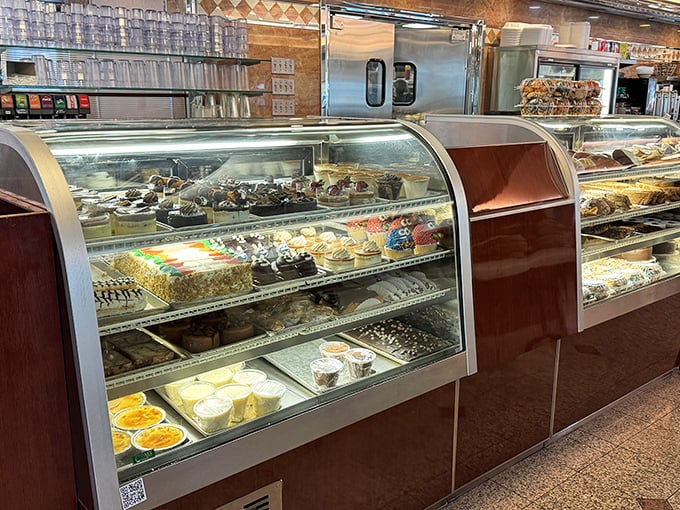 The dessert case at Minella's—where willpower goes to die and "I'll just have coffee" turns into "and a slice of that... and that."