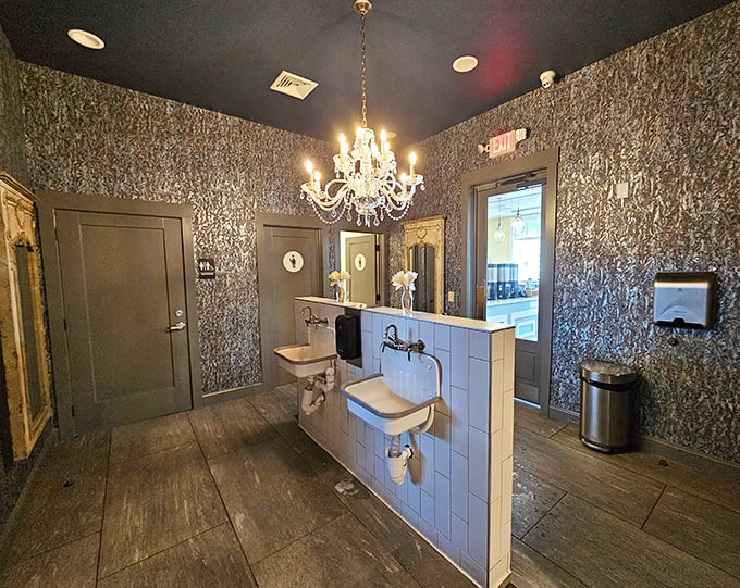 Even the restroom gets the luxury treatment, with oyster shell wallpaper and a chandelier that makes washing your hands feel like a special occasion.