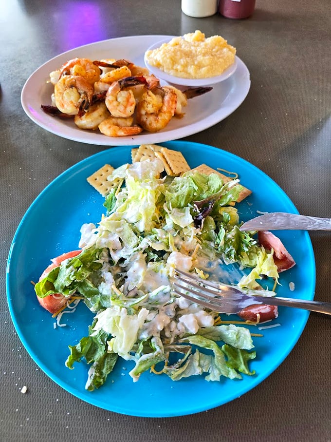 Fresh greens and seafood sharing a plate—nature's way of saying "balance is important, but so is flavor."