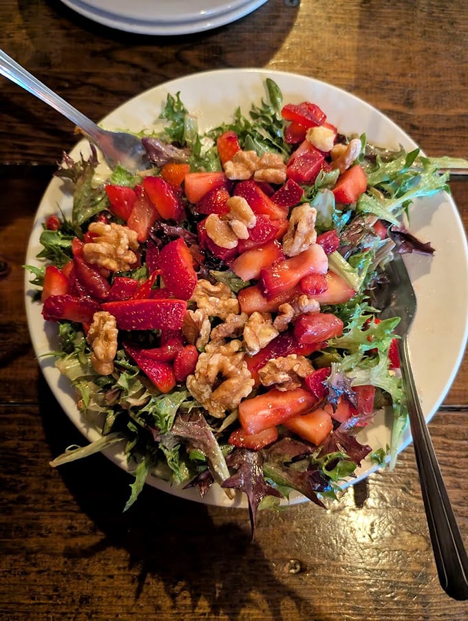 A salad that actually excites—mixed greens playing host to strawberries and walnuts. Even vegetable skeptics might be converted by this colorful arrangement.