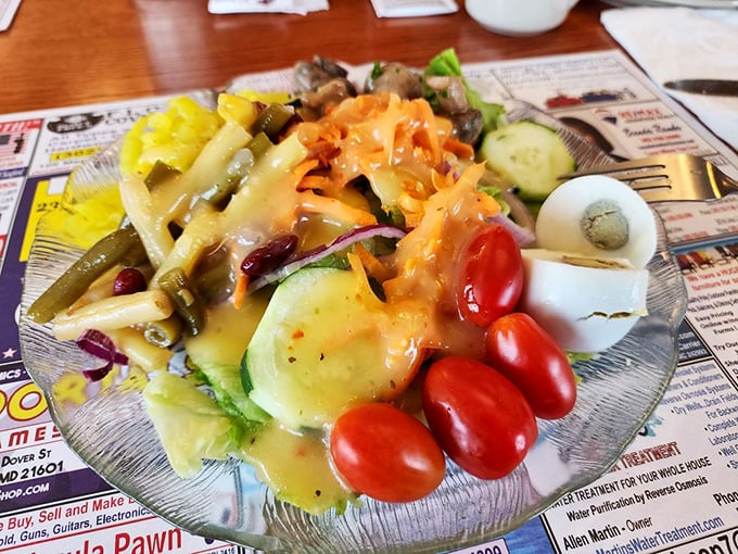 This garden salad isn't just an obligation to vegetables—it's a vibrant, fresh counterpoint to the diner's heartier offerings.