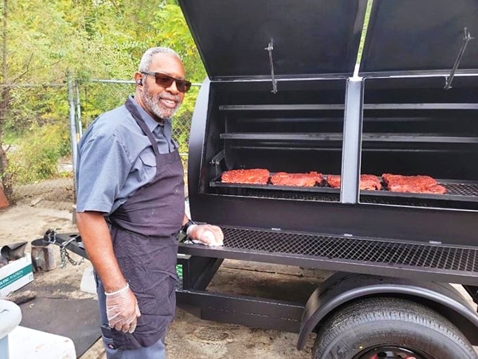 Behind every great barbecue joint is someone who understands that perfect meat requires perfect timing—and a smile that says "I know what I'm doing."